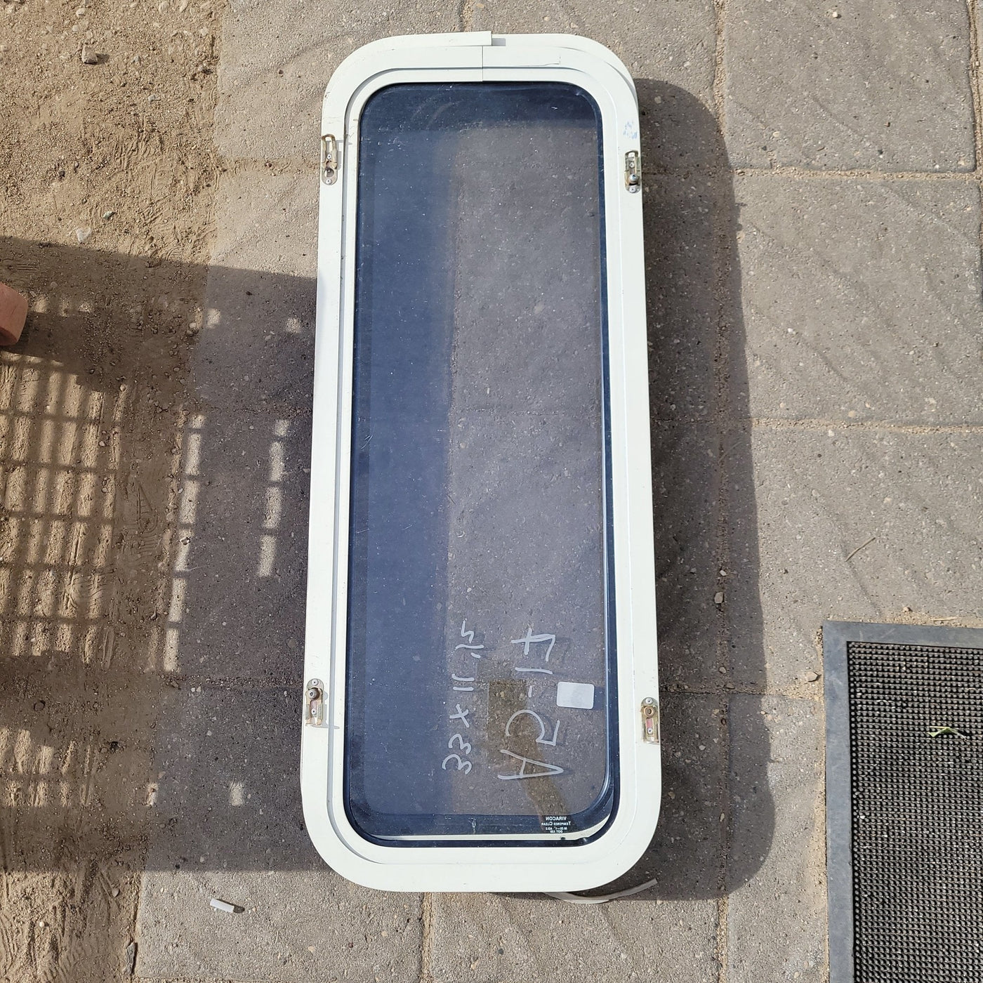 Used Black Radius Non-Opening Window : 33 X 11 1/2 X 2" D — RV Part Shop CA